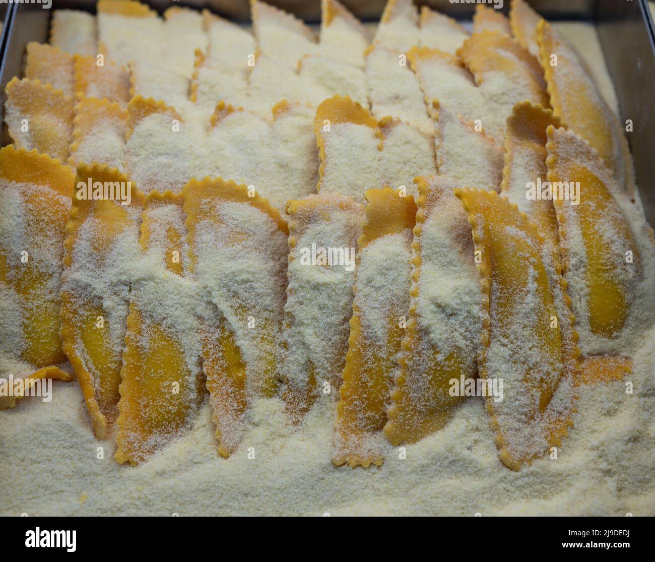 Italian food, handmade mezzaluna pasta ravioli stuffed with four ...