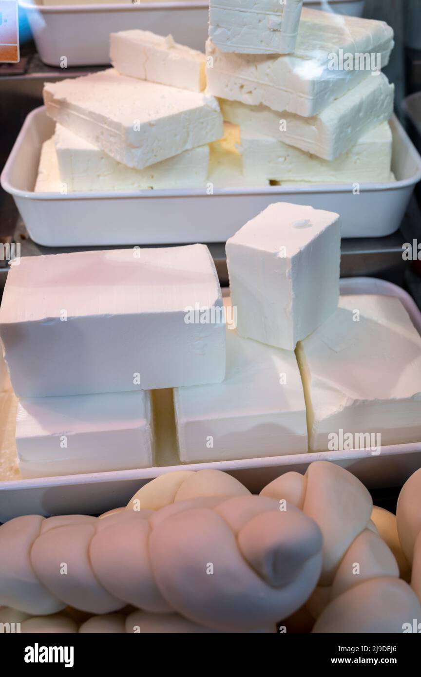 White soft salted feta and bulgarian cheeses on market display Stock ...
