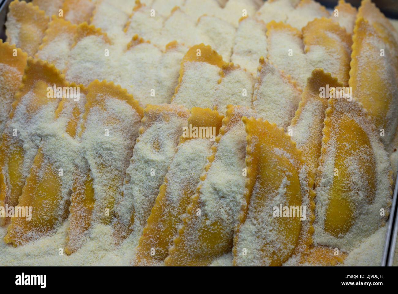 Italian food, handmade mezzaluna pasta ravioli stuffed with four ...