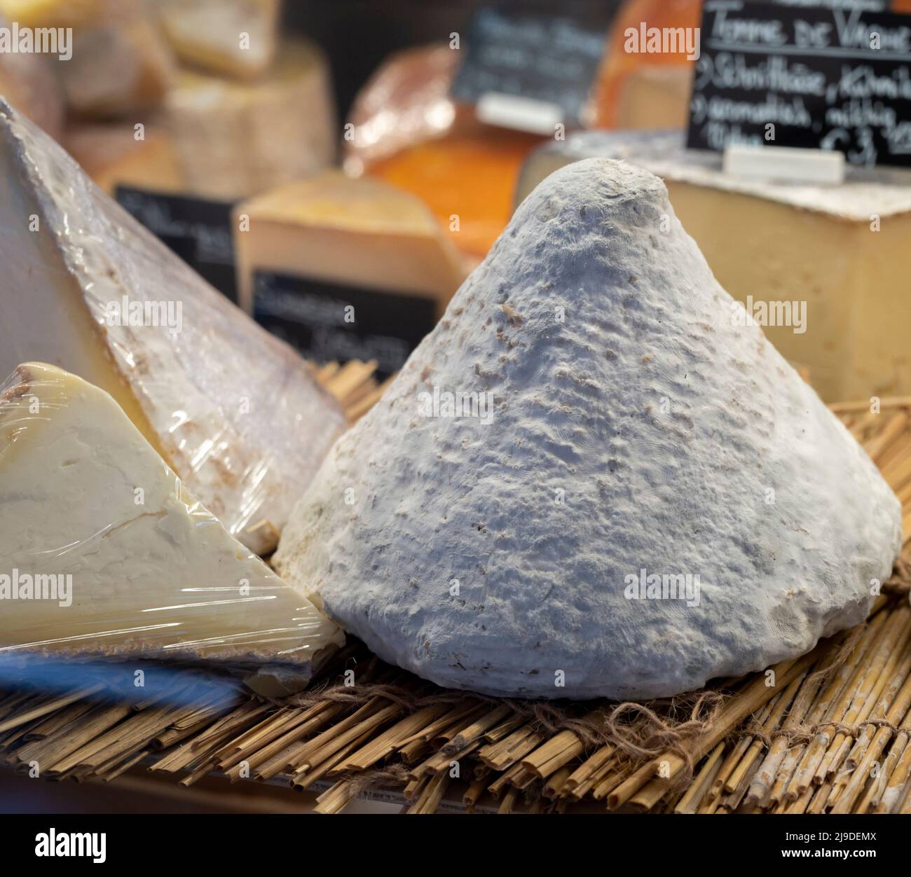 French cheese cone shaped port aubry on farmer market Stock Photo - Alamy