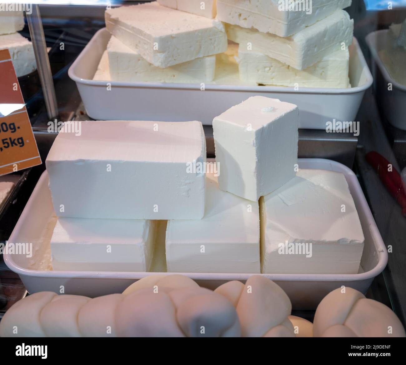 White soft salted feta and bulgarian cheeses on market display Stock ...