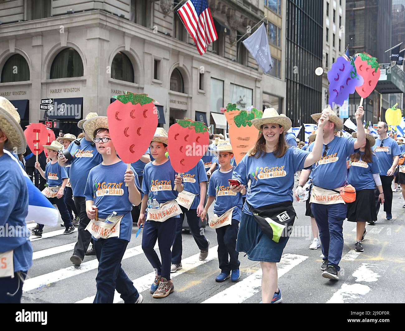 Participants march in the Celebrate Israel Parade on Fifth Avenue on ...