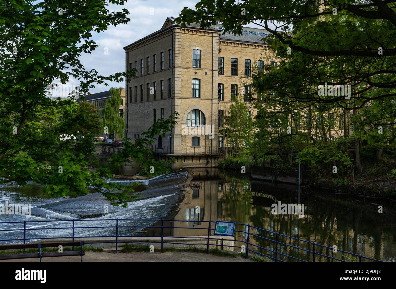 Salts Mill, Saltaire, seen across the River Aire from Roberts Park ...