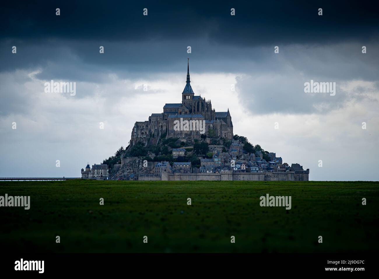 The Mont Saint-Michel tidal island in beautiful twilight during a storm ...
