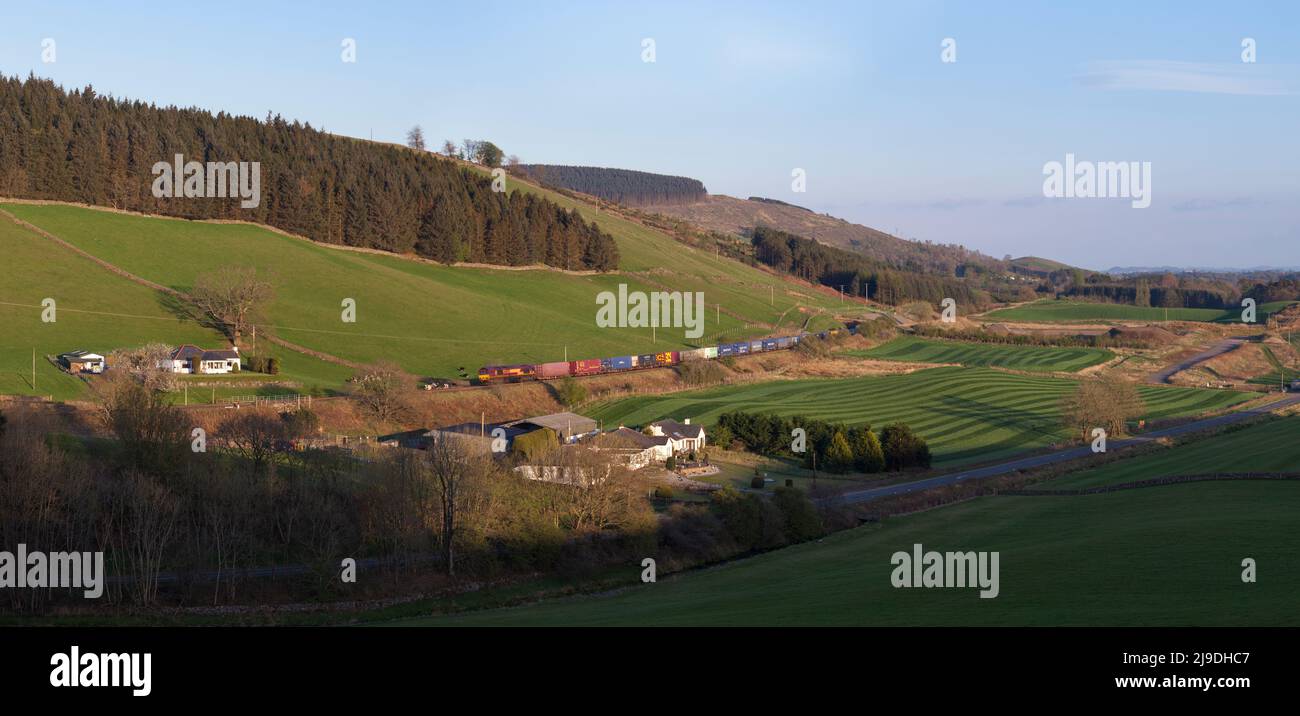 DB Cargo class 66 diesel locomotive 66164 hauling an intermodal ...