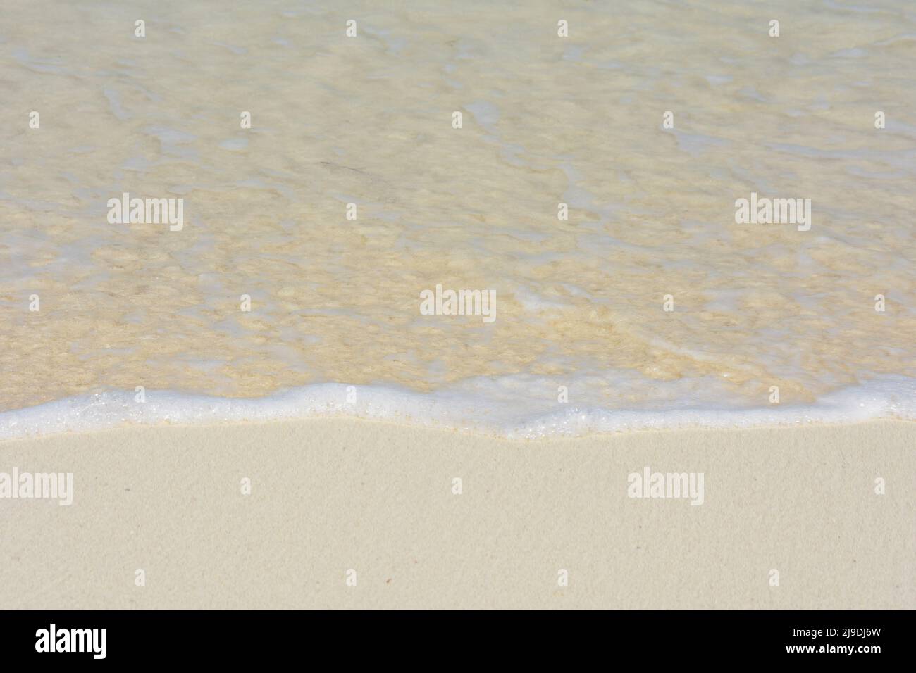 Foamy waves lapping beach hi-res stock photography and images - Alamy