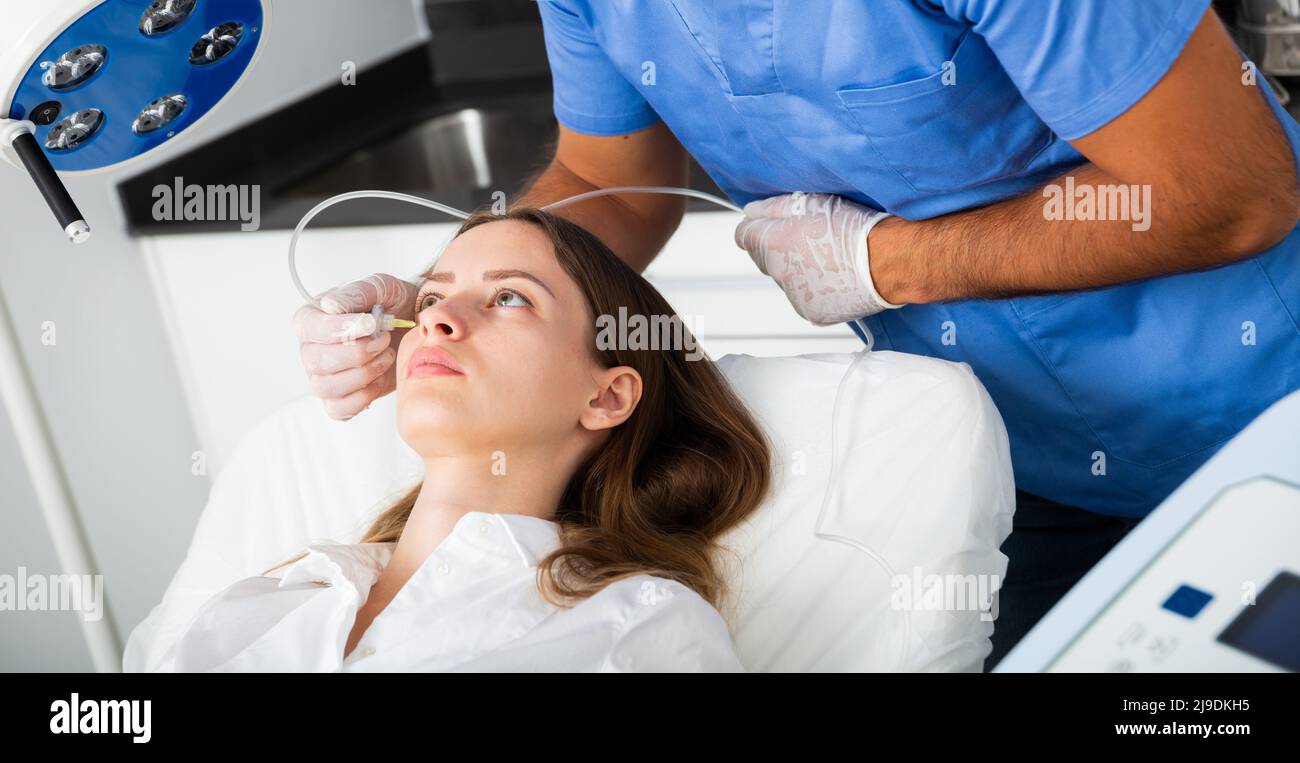 Female client getting carbon dioxide injections for face skin Stock ...