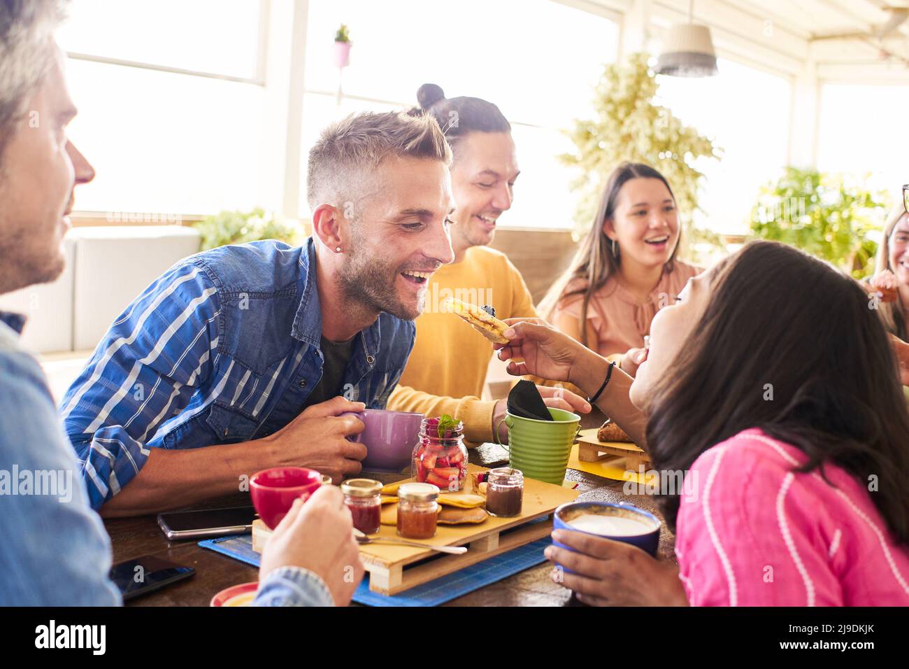 Group of Happy friends having breakfast in the restaurant Stock Photo ...