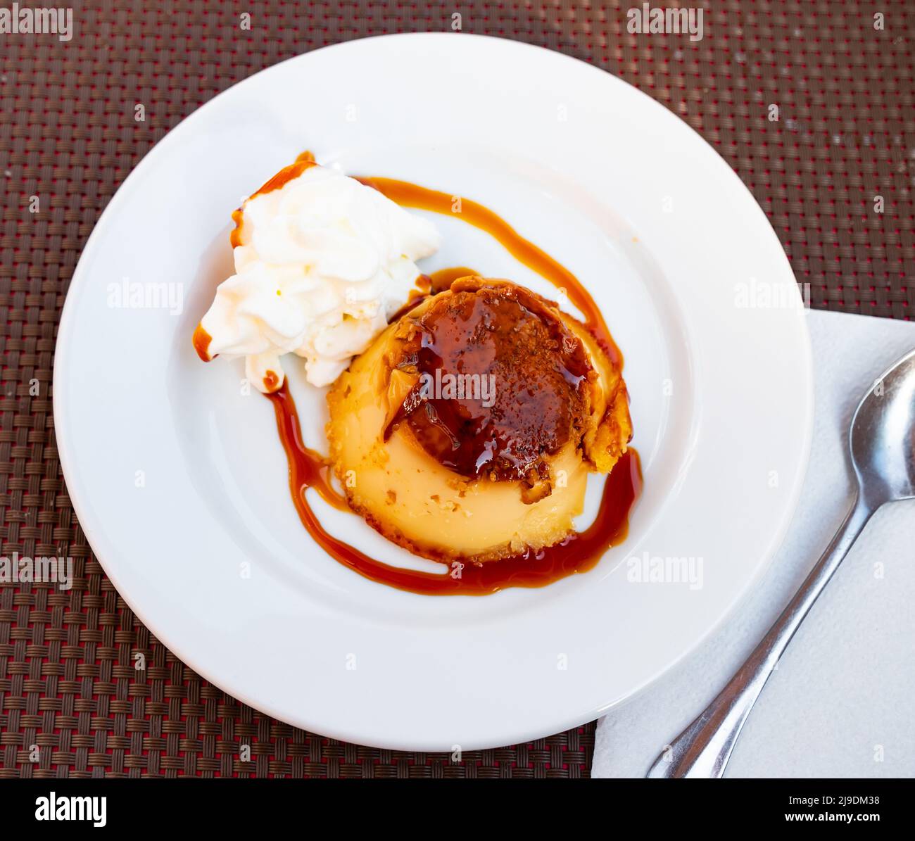 Caramel pudding dessert. Flan with cream Stock Photo - Alamy