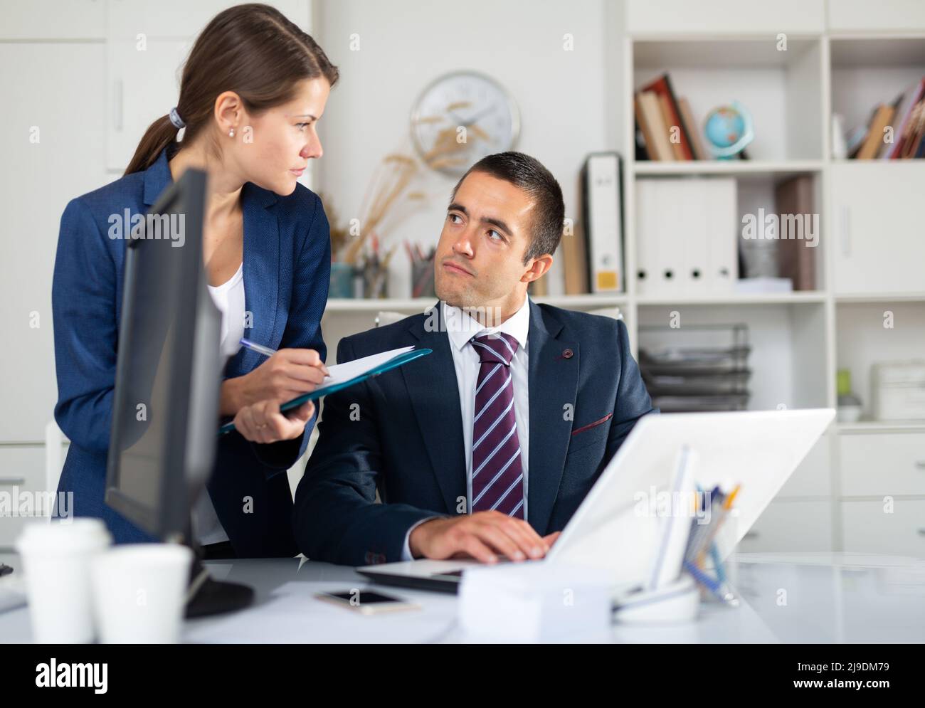 Directors assistant makes daily routine and writes down instructions in ...