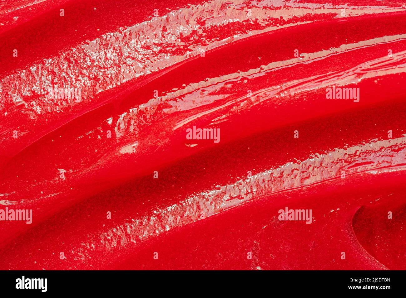 Red gel texture. Cosmetic clear liquid cream smudge. Skin care product ...