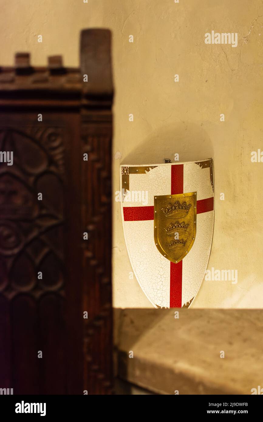 A white shield hangs on the wall at the 1926 Medieval-style Hammond ...
