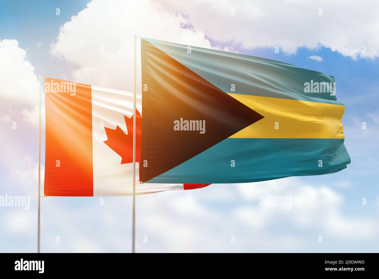 Sunny blue sky and flags of bahamas and canada Stock Photo - Alamy