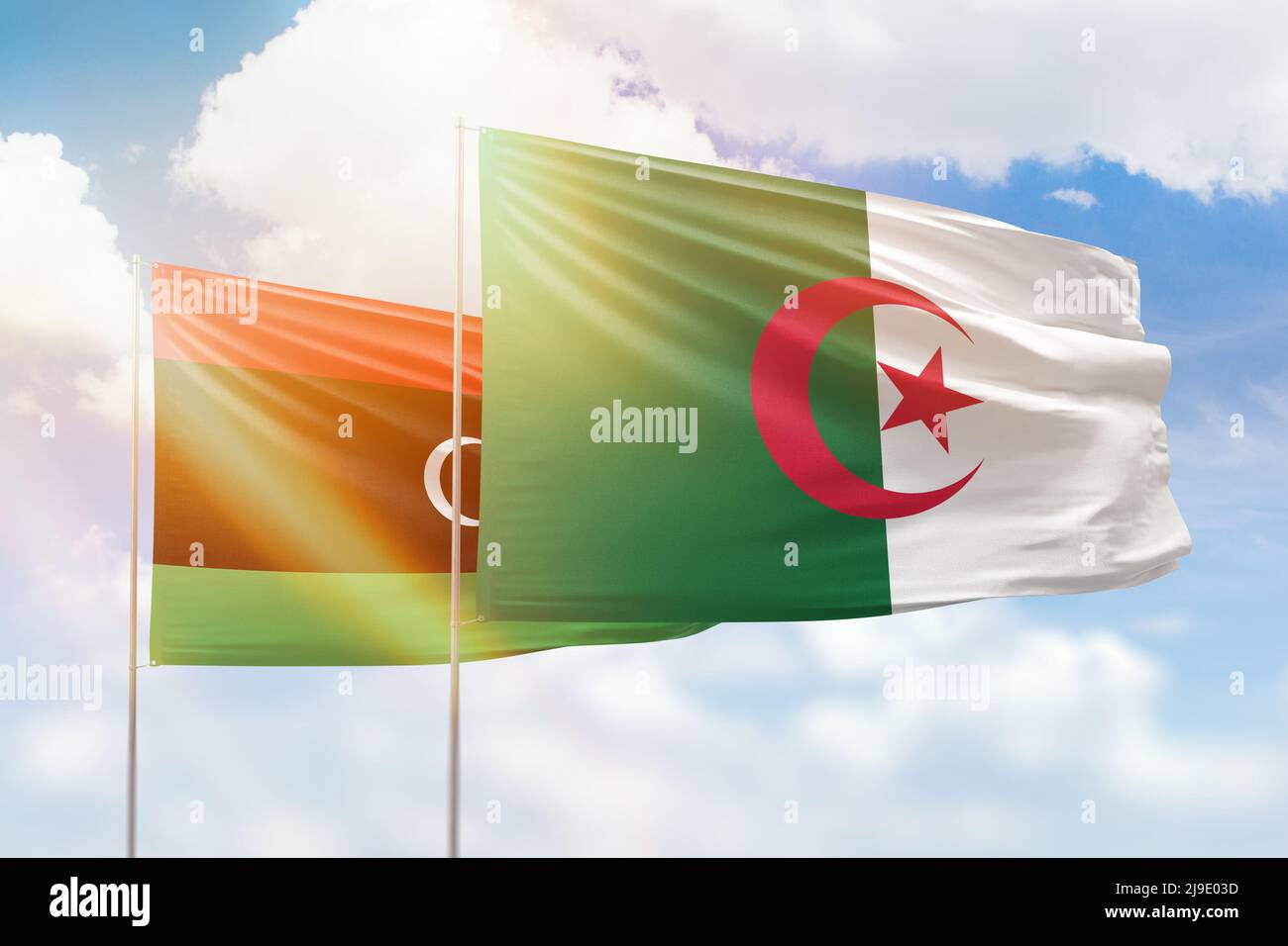 Sunny blue sky and flags of algeria and libya Stock Photo - Alamy