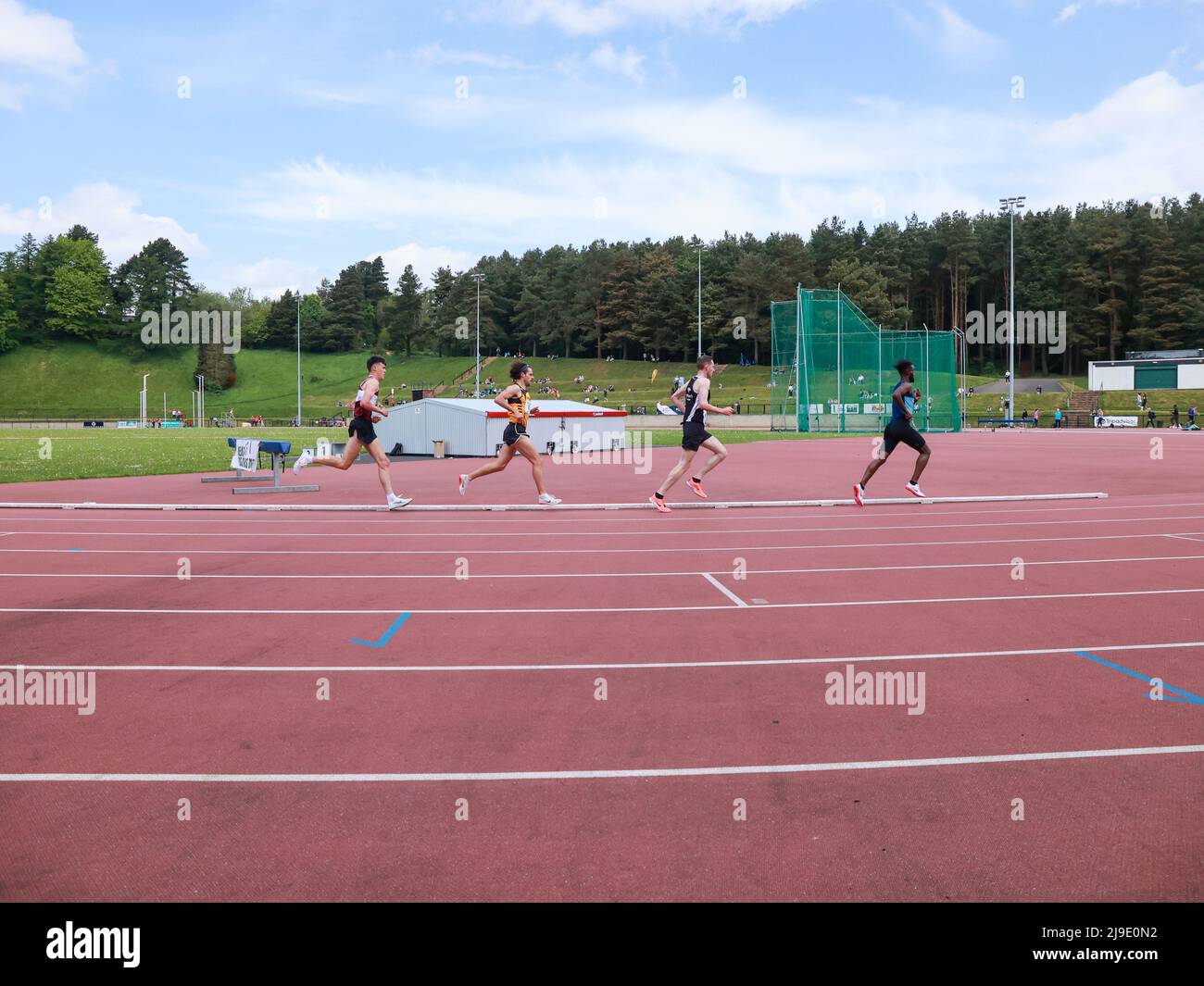 Four male track athletes hi-res stock photography and images - Alamy