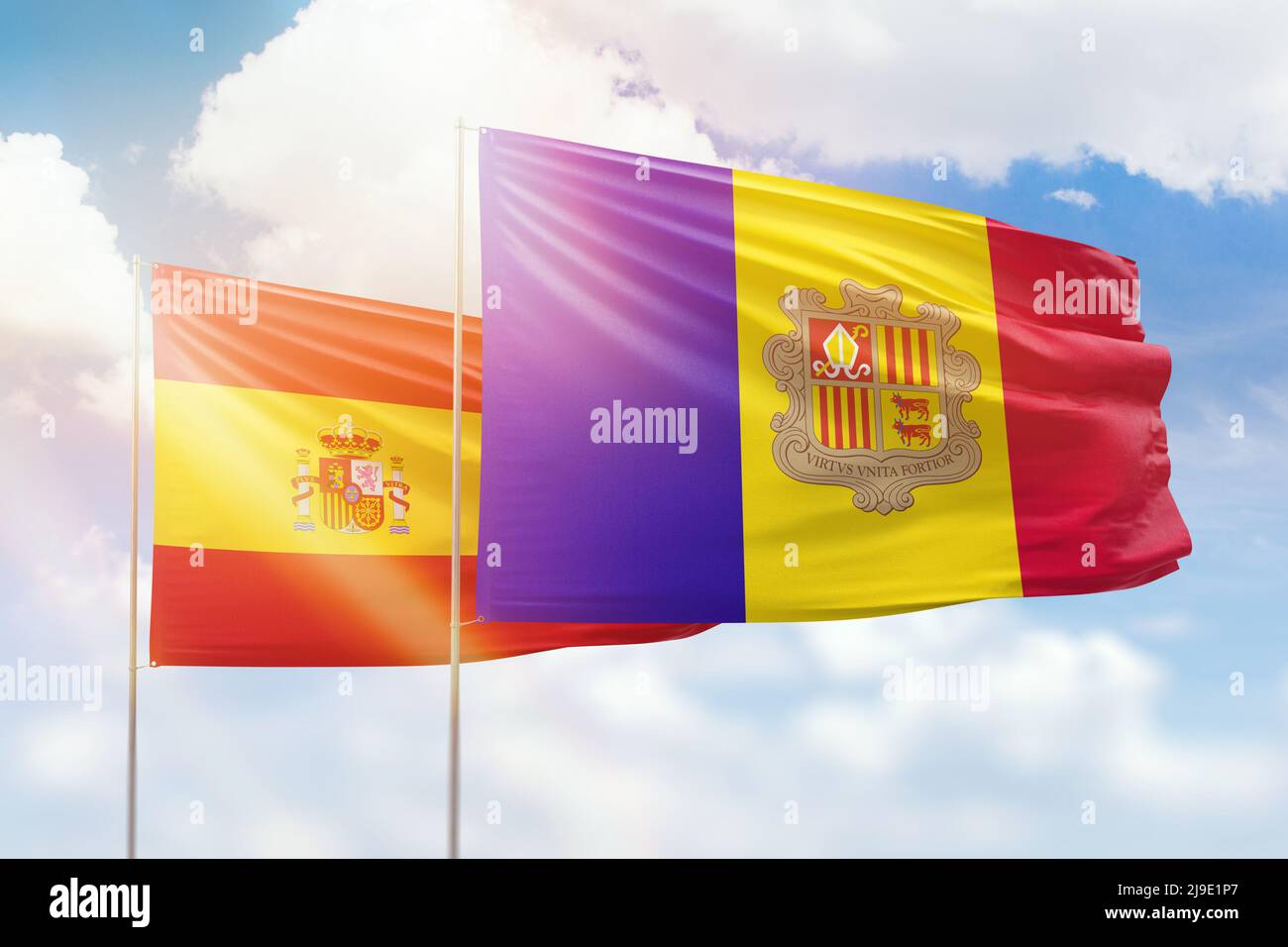 Sunny blue sky and flags of algeria and spain Stock Photo - Alamy