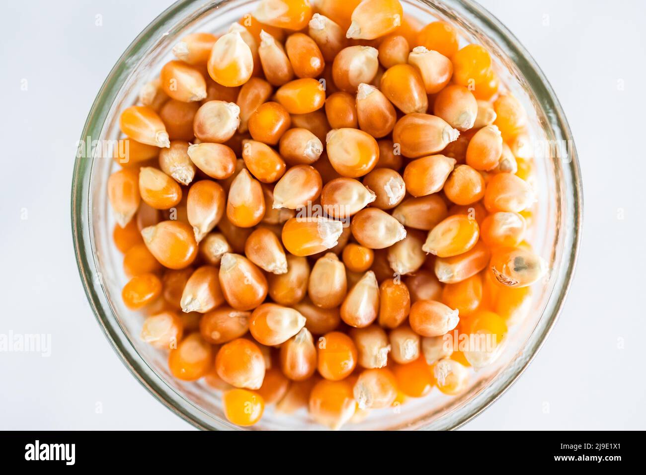 corn kernels for making popcorn in glass jar, concept of simple natural ...
