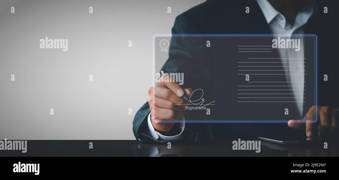 businessman use electronic pen sign signature on electronic E-signing ...