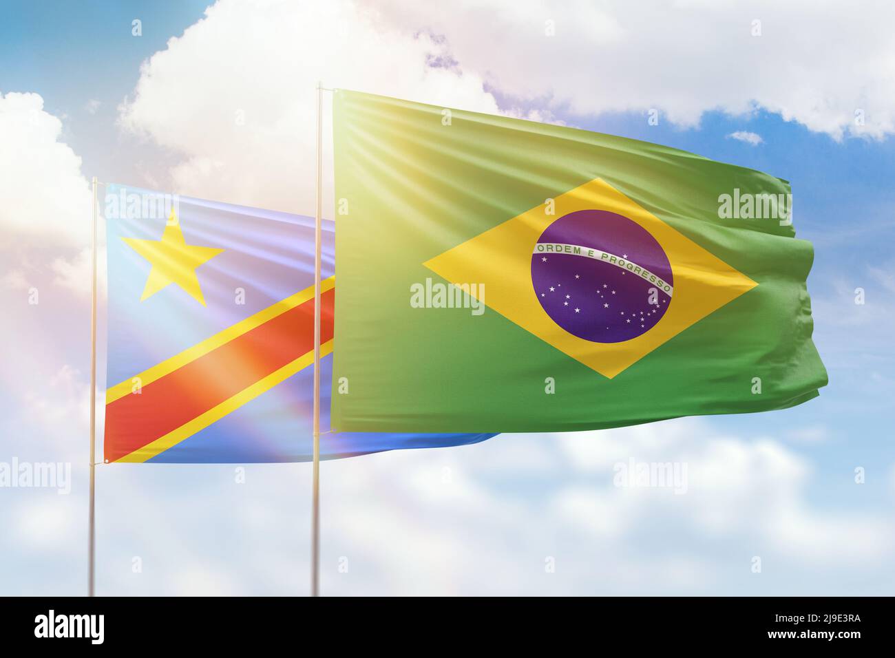Sunny blue sky and flags of brazil and dr congo Stock Photo - Alamy
