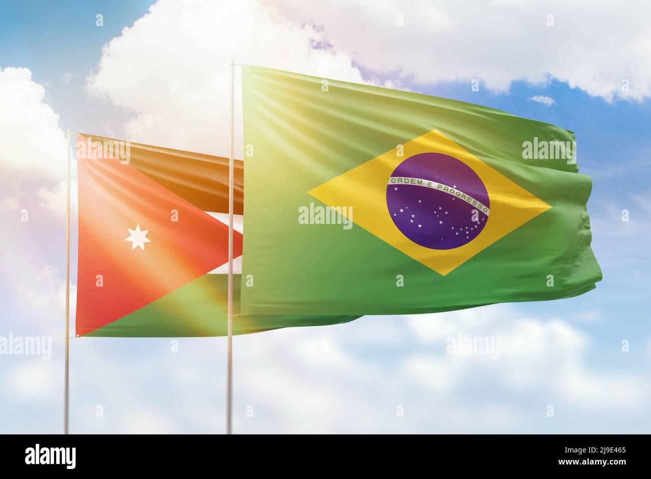 Sunny blue sky and flags of brazil and jordan Stock Photo - Alamy