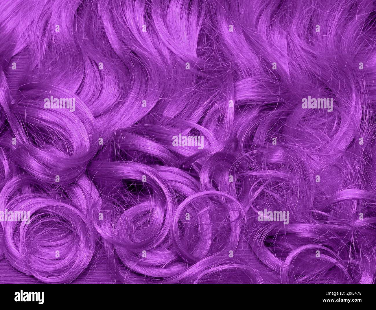 Purple coloured dyed hair with curly waves texture background Stock ...