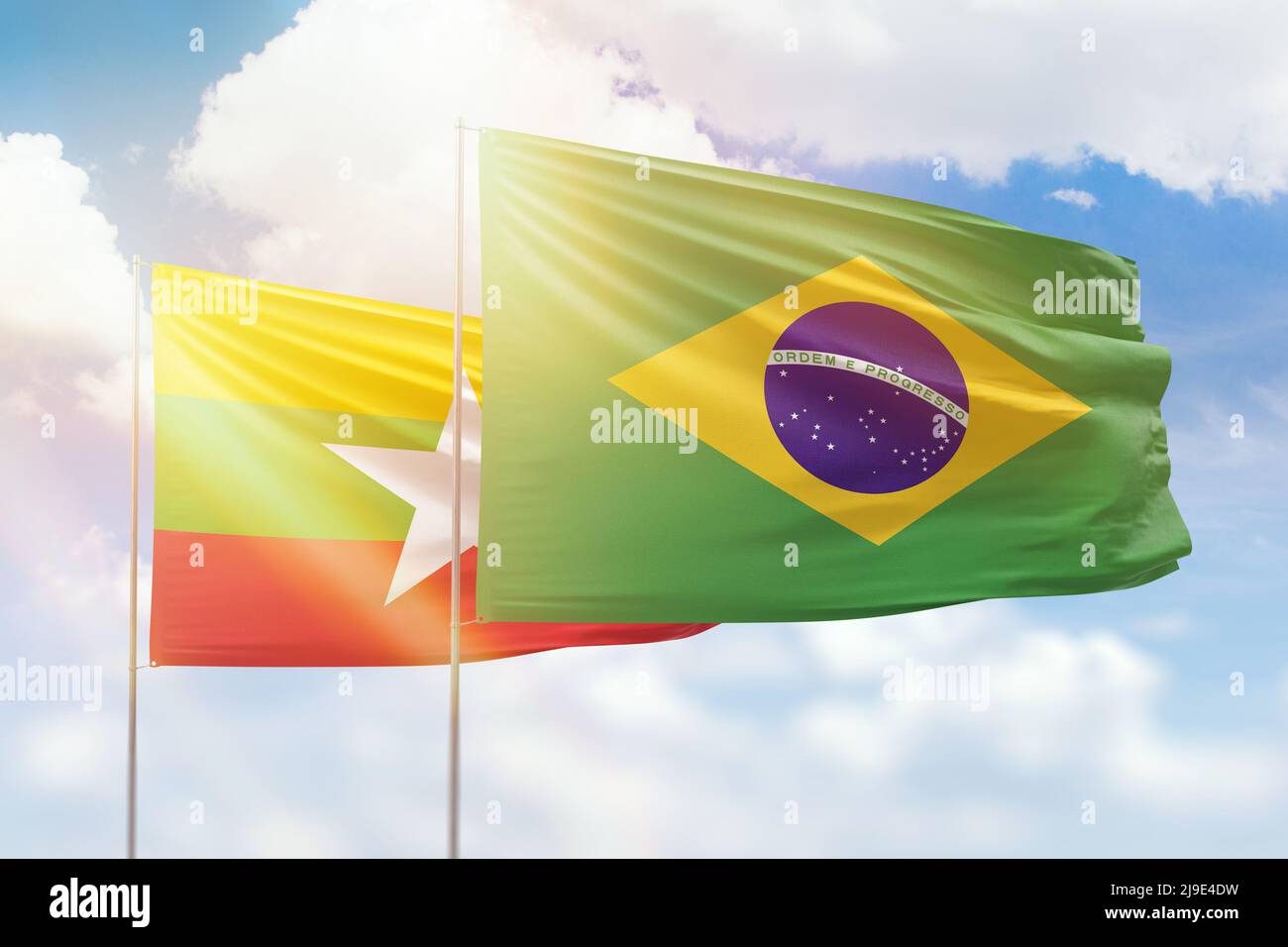 Sunny blue sky and flags of brazil and myanmar Stock Photo - Alamy