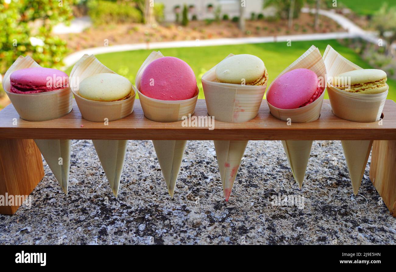 Colorful macaron cookies in paper cones Stock Photo - Alamy