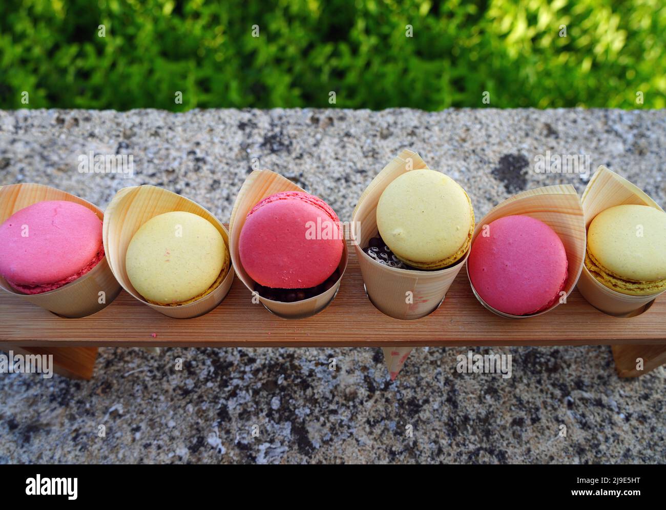 Colorful macaron cookies in paper cones Stock Photo - Alamy