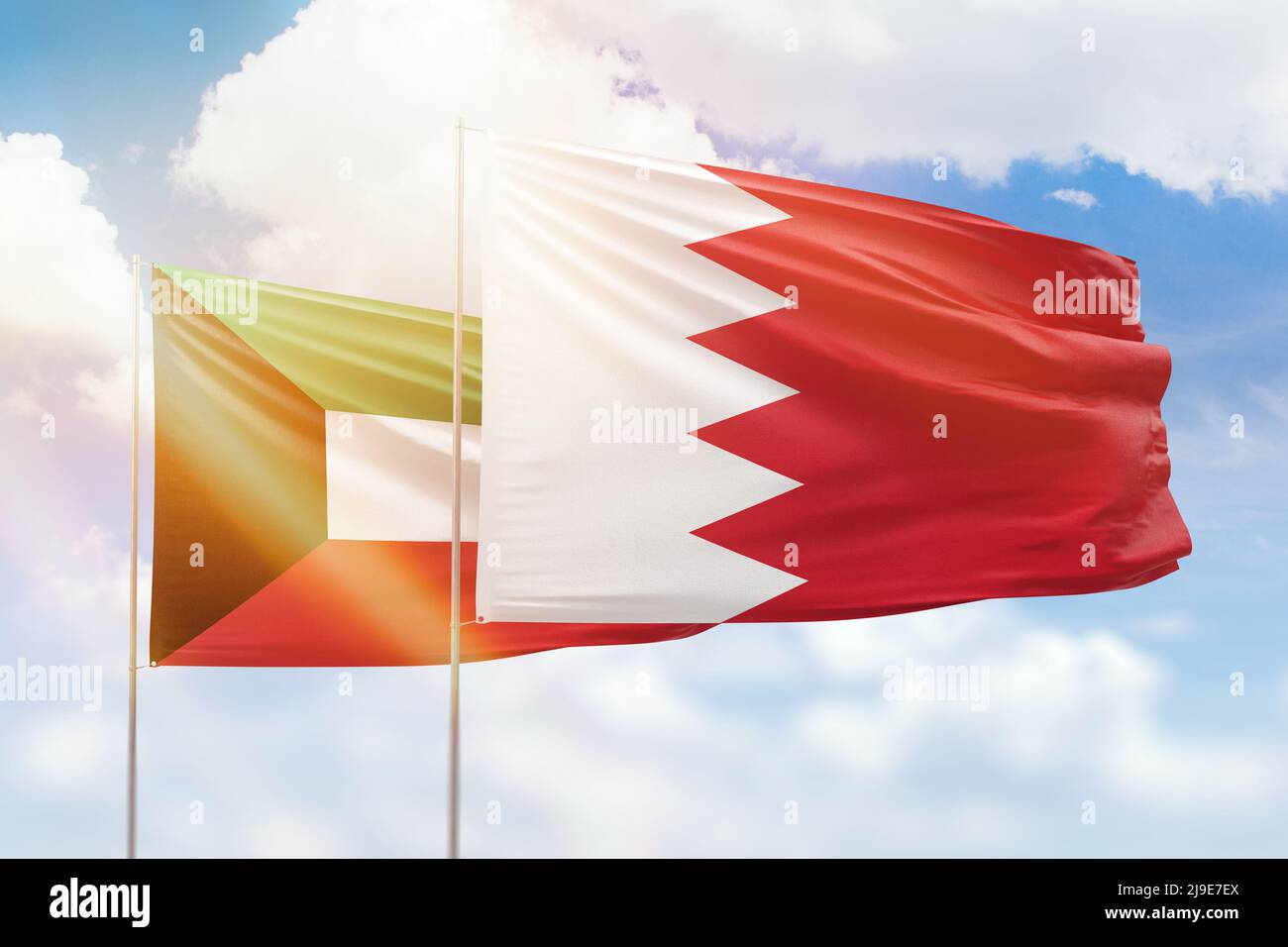 Sunny blue sky and flags of bahrain and kuwait Stock Photo - Alamy