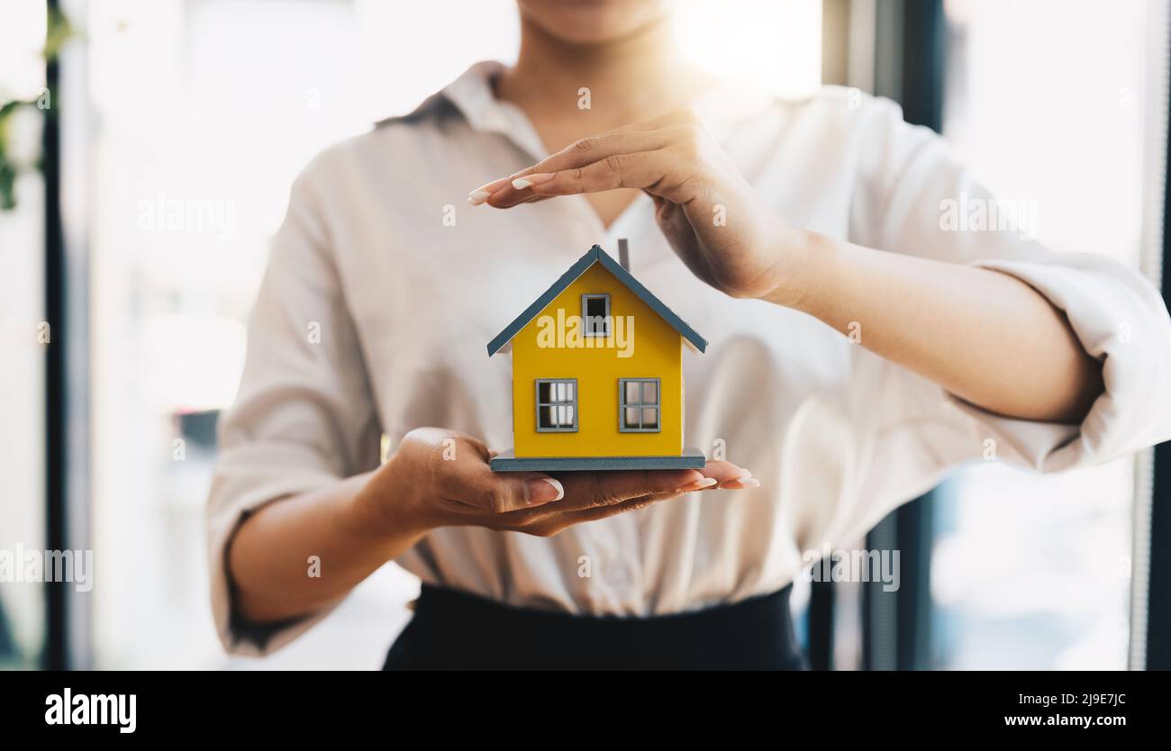 Concept home insurance, protection from burglary or destruction. Woman ...