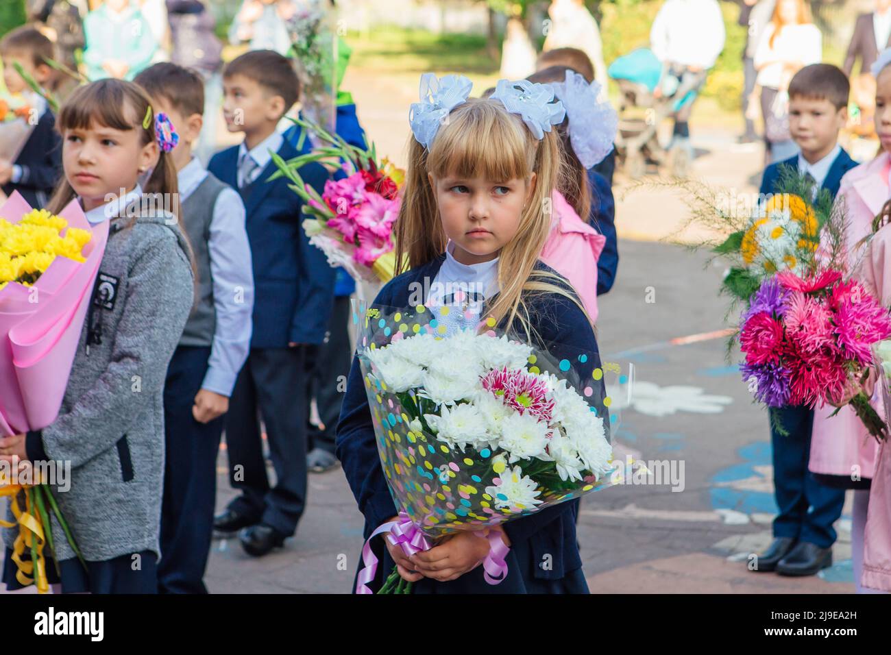 Meeting with the first-grade pupils and teacher at schoolyard. The day ...