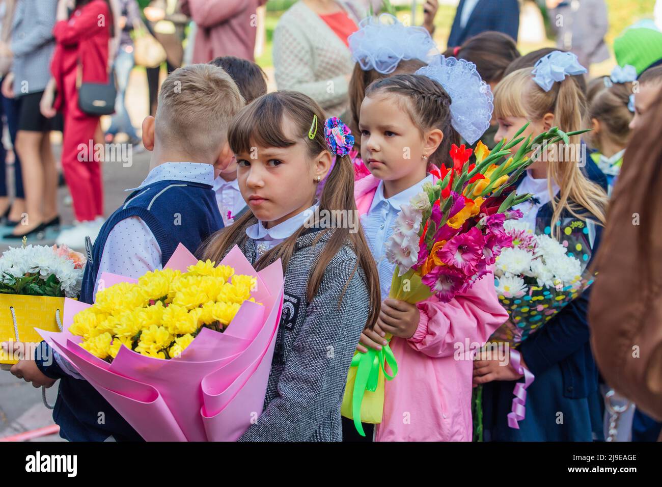 Meeting with the first-grade pupils and teacher at schoolyard. The day ...