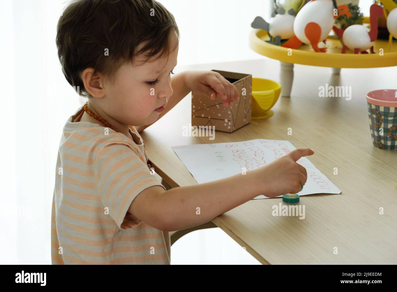 Kids having fun at home by the table, creating hand made art. Children ...