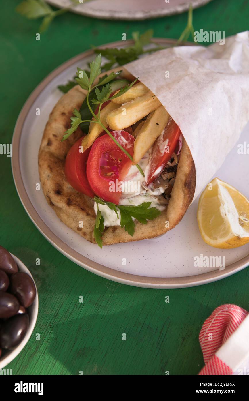 Greek chicken souvlaki ona pita with fresh vegetables with tzatziki ...