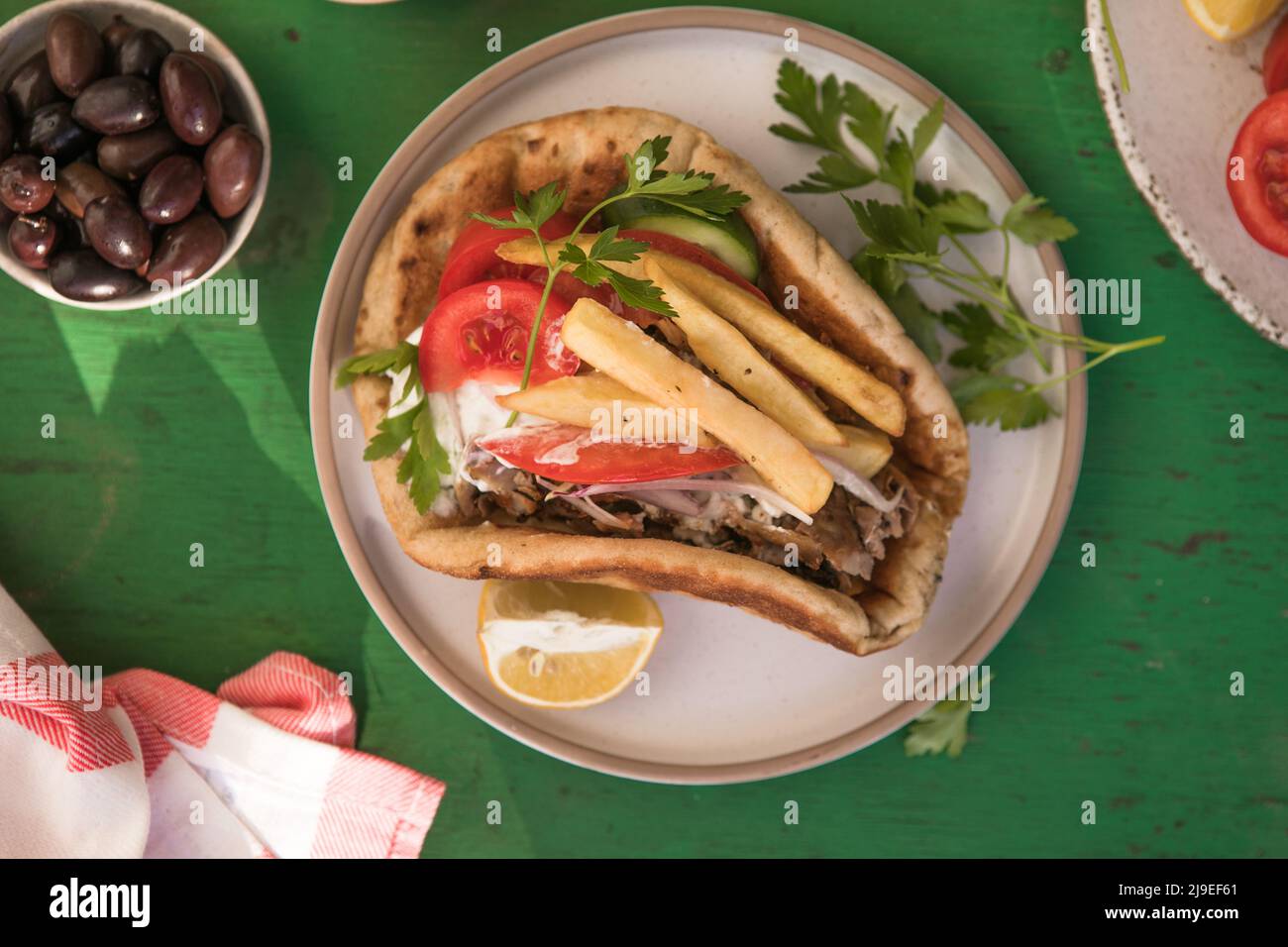 Greek chicken souvlaki ona pita with fresh vegetables with tzatziki ...