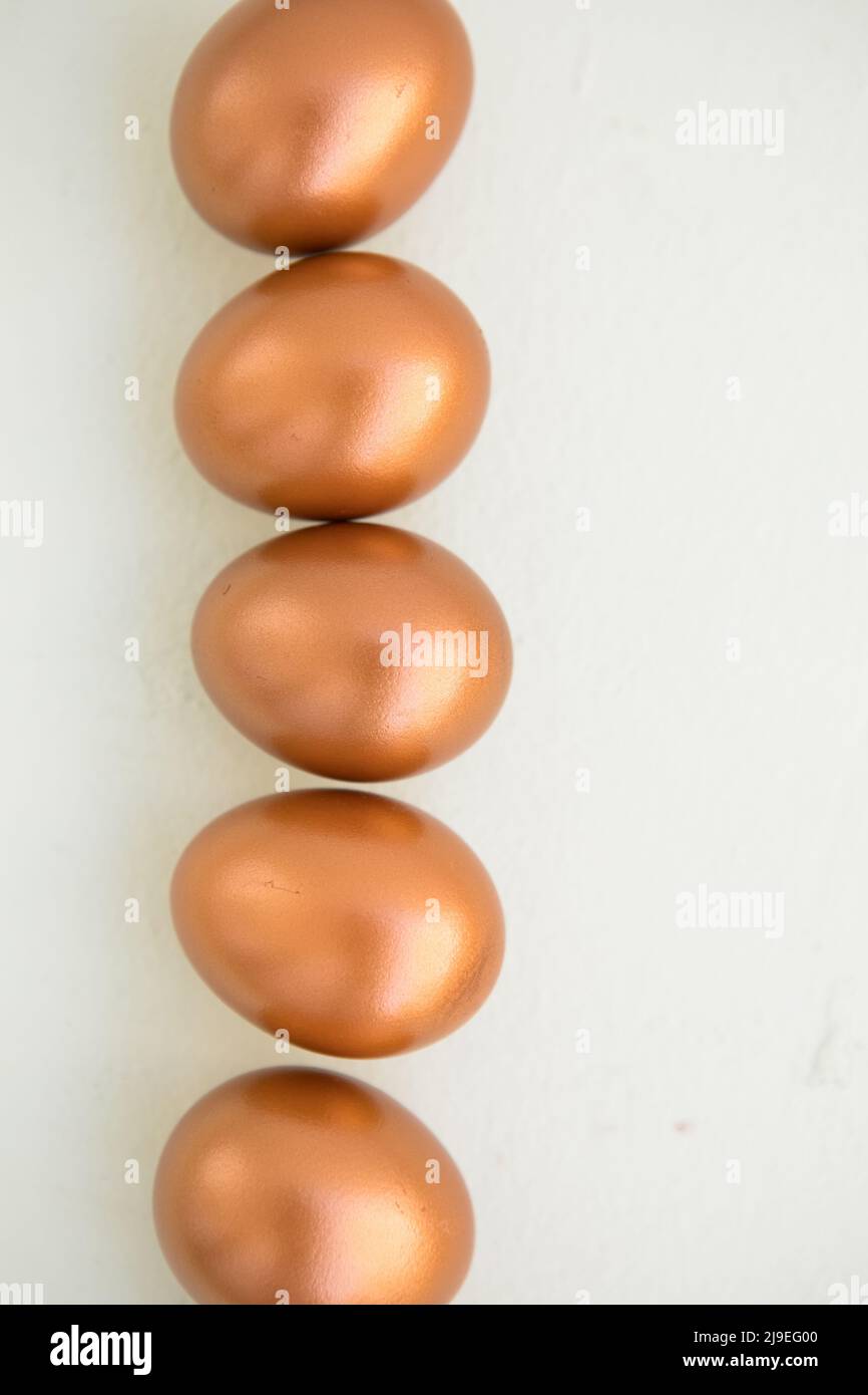 Golden eggs. The minimal concept. An Easter card with a copy of the ...