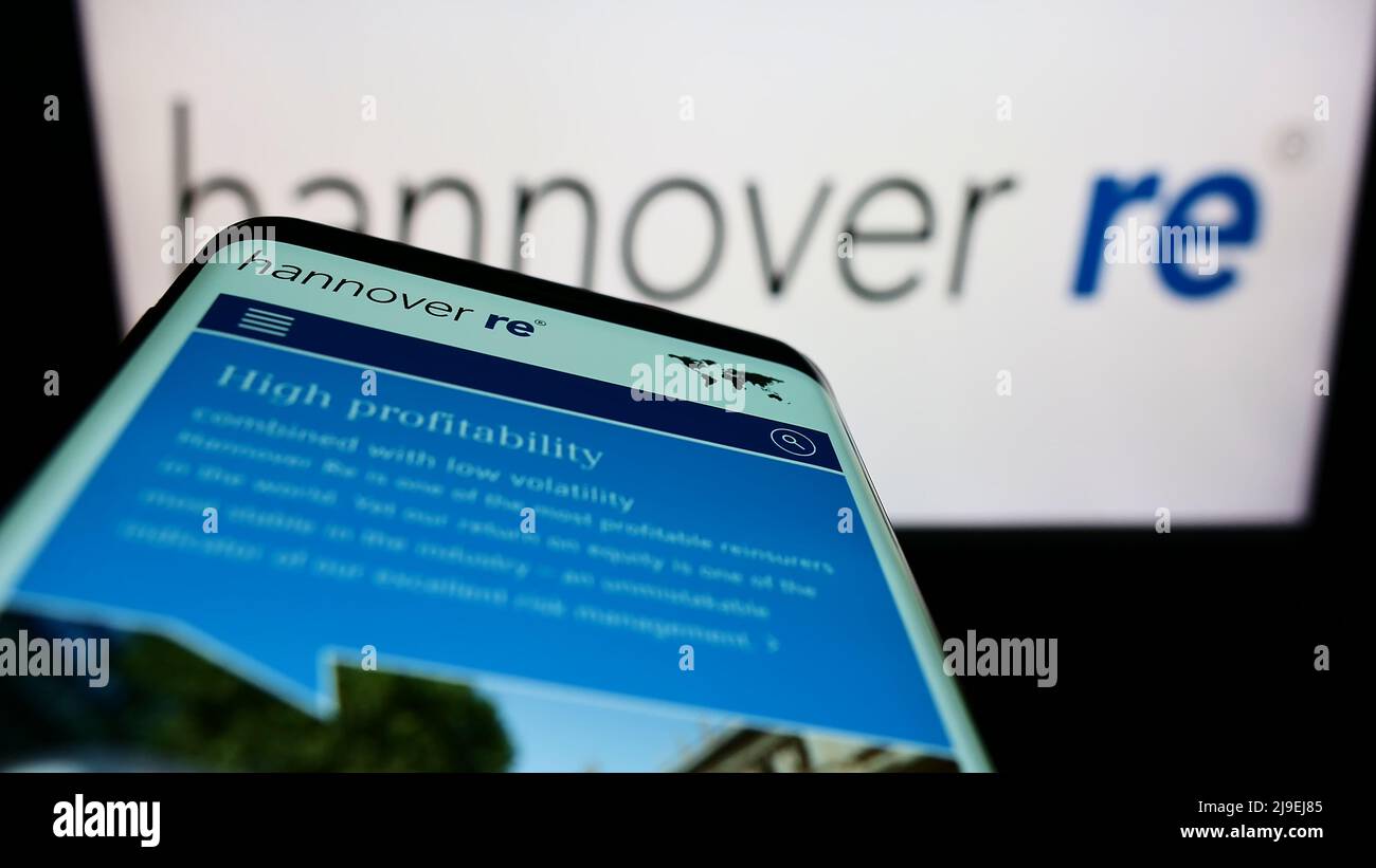 Mobile phone with webpage of German reinsurance company Hannover Re on ...