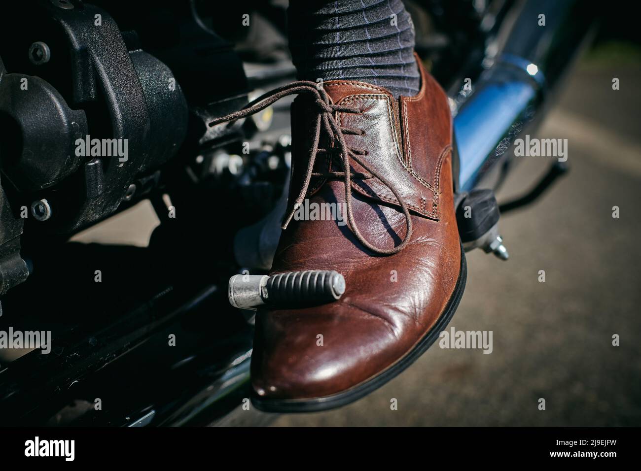 Distinguished Gentleman's Ride Classic elegant shoe on gear shift on ...