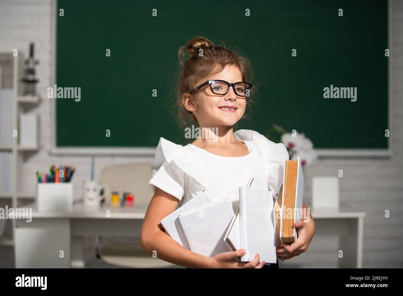 Little school girl student learning in class, study english language at ...