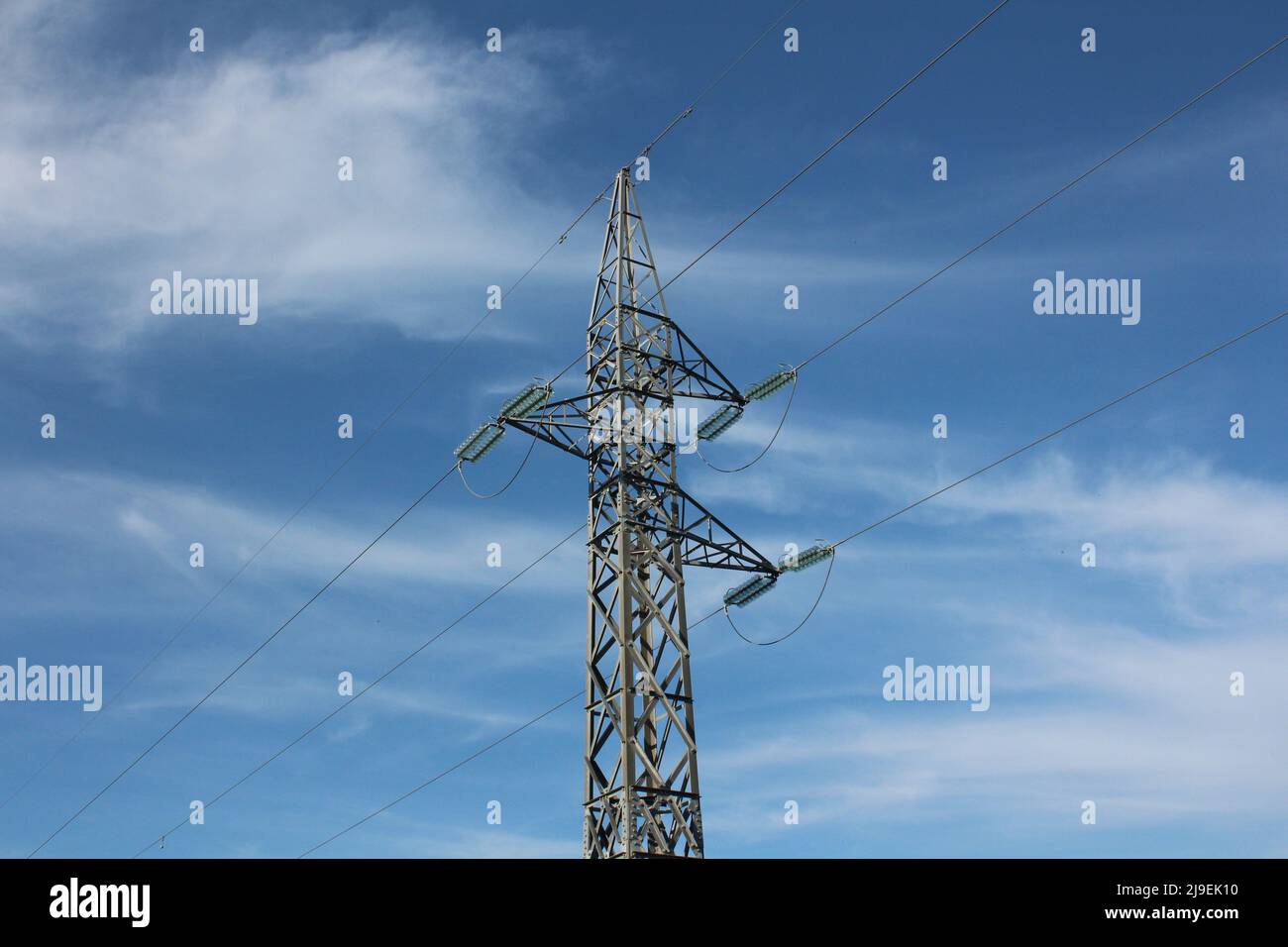 High voltage electric pylon on the sky background Stock Photo - Alamy