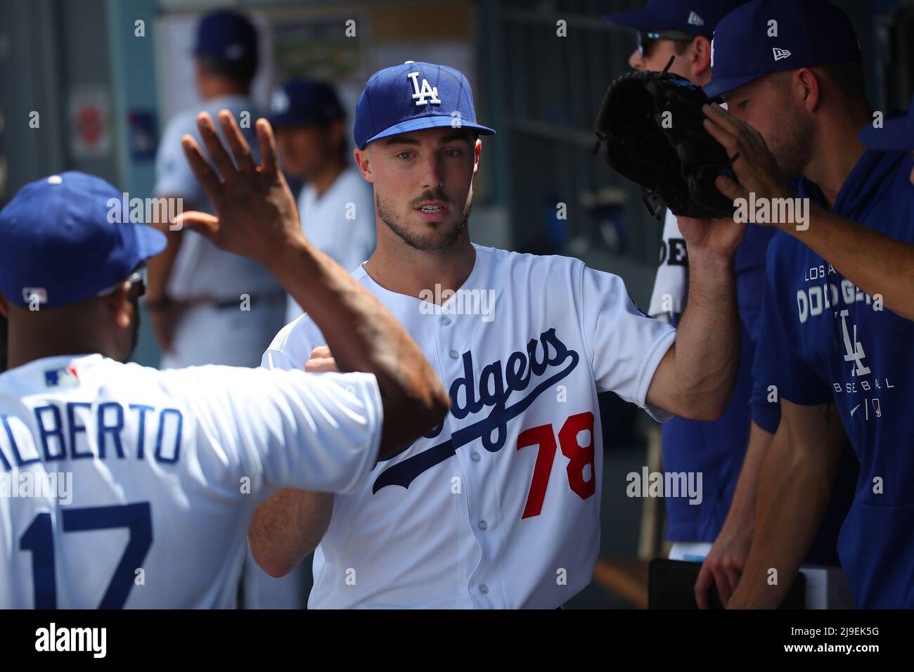 Los Angeles Dodgers pitcher Michael Grove (78) hi-fives his teammates ...