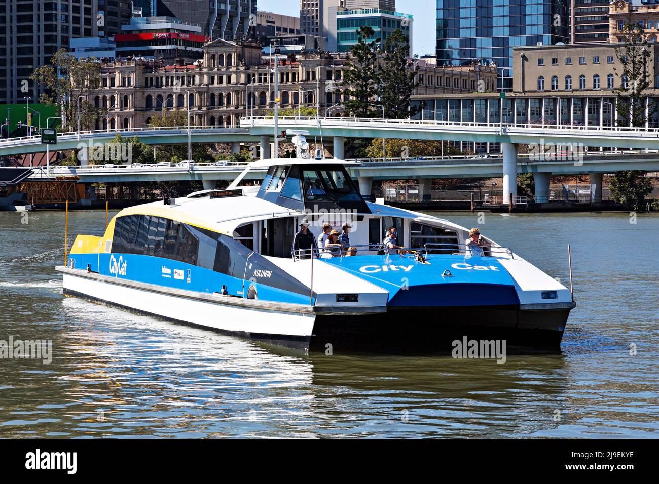 Brisbane Australia / A fast CityCat Ferry carries passengers along the ...
