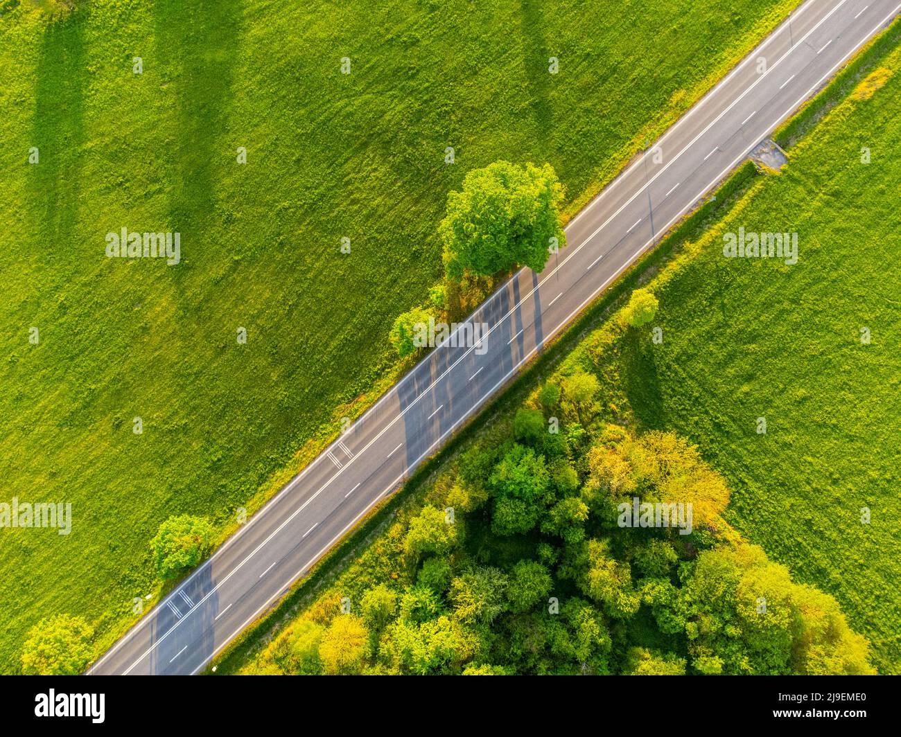 Straight asphalt road from above Stock Photo - Alamy