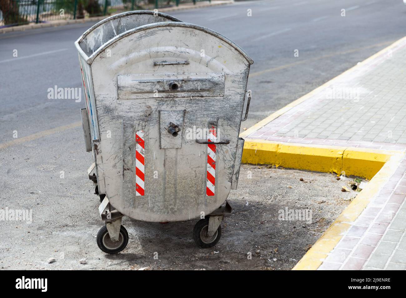 Wheeled trash can stands on a roadside, close up outdoor photo Stock ...