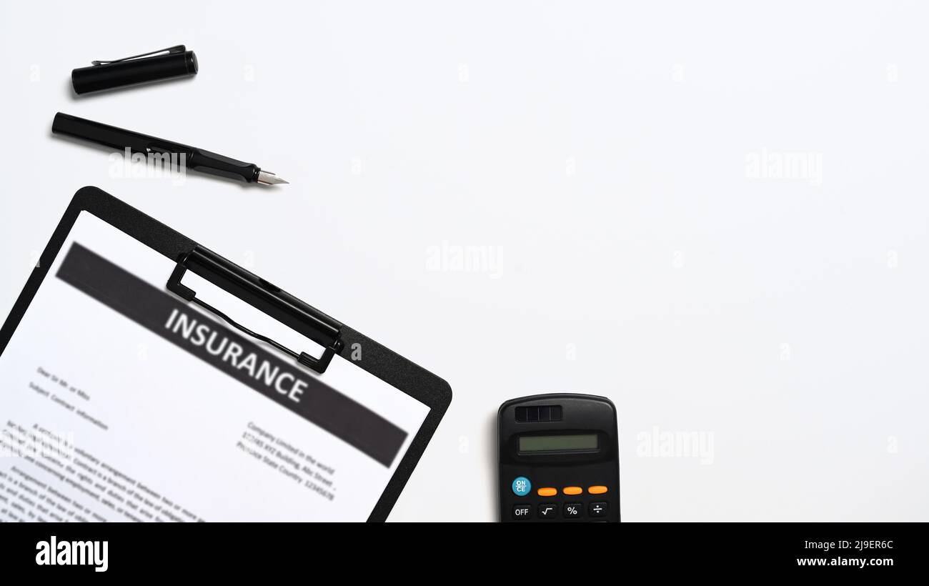 Top view insurance claim form, pen and calculator on white background ...