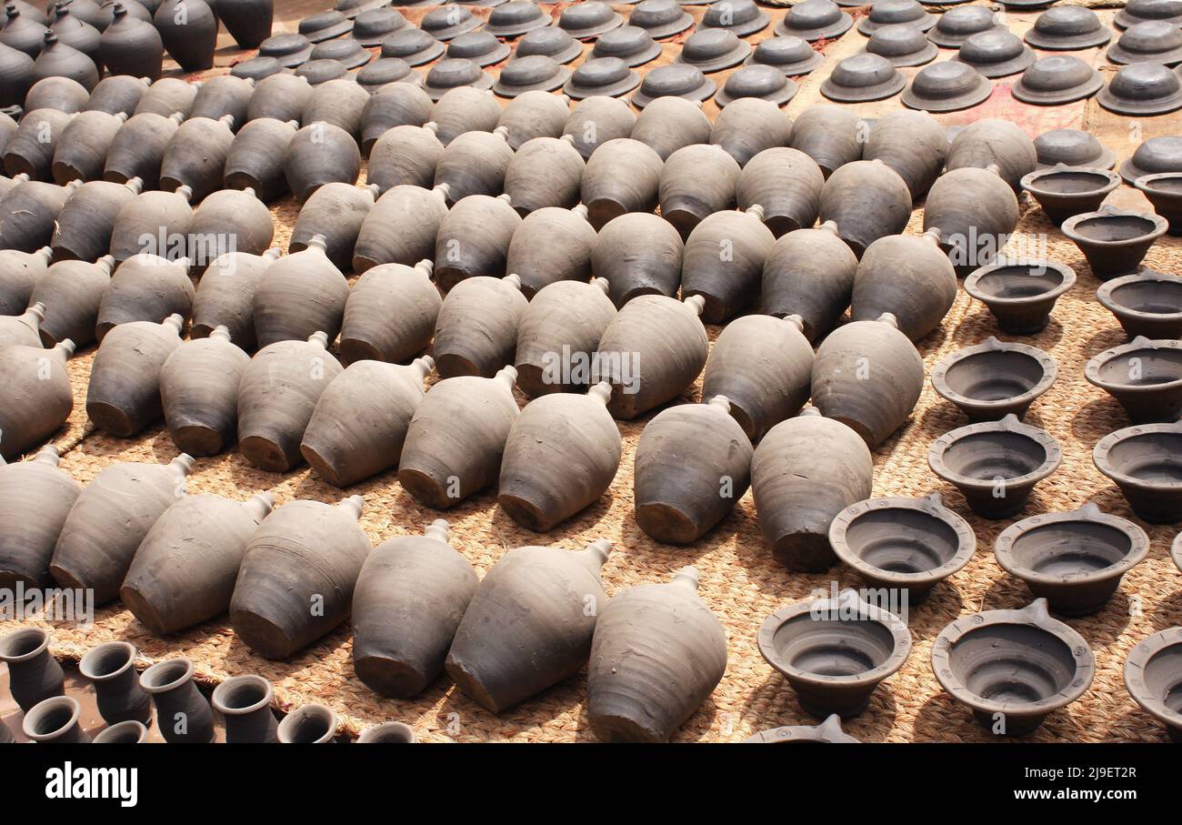 Traditional nepalese souvenirs - handmade clay jugs, dishes, bowls ...