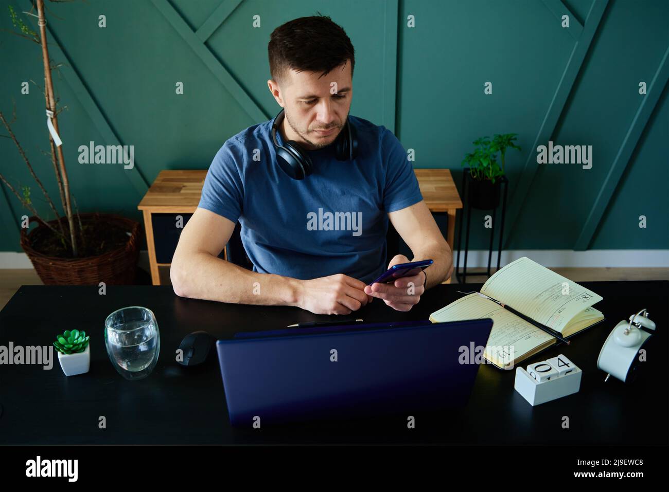 Man working at home office. Freelancer sitting at workplace and ...