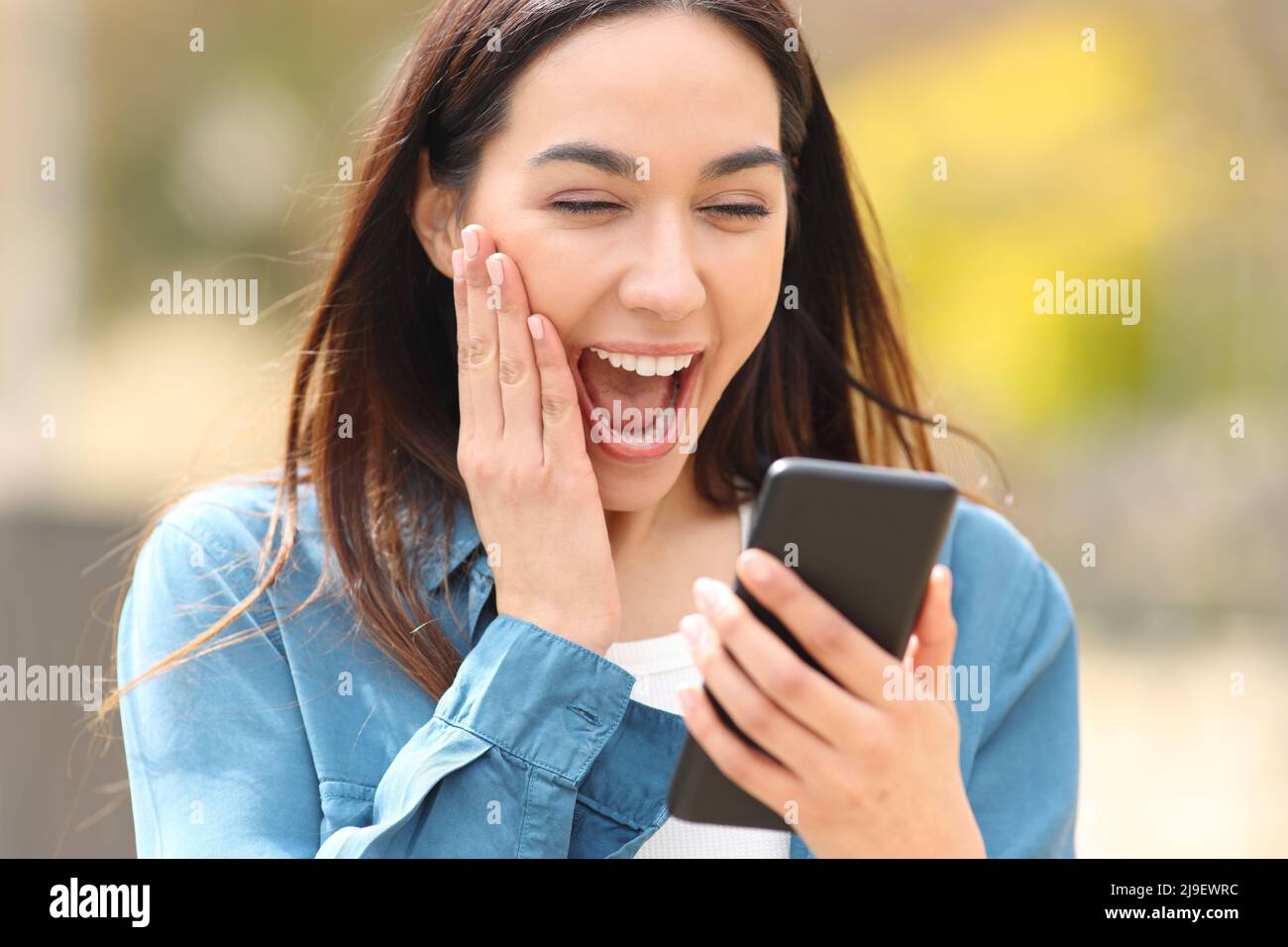 Urban woman happy shocked excited hi-res stock photography and images - Alamy