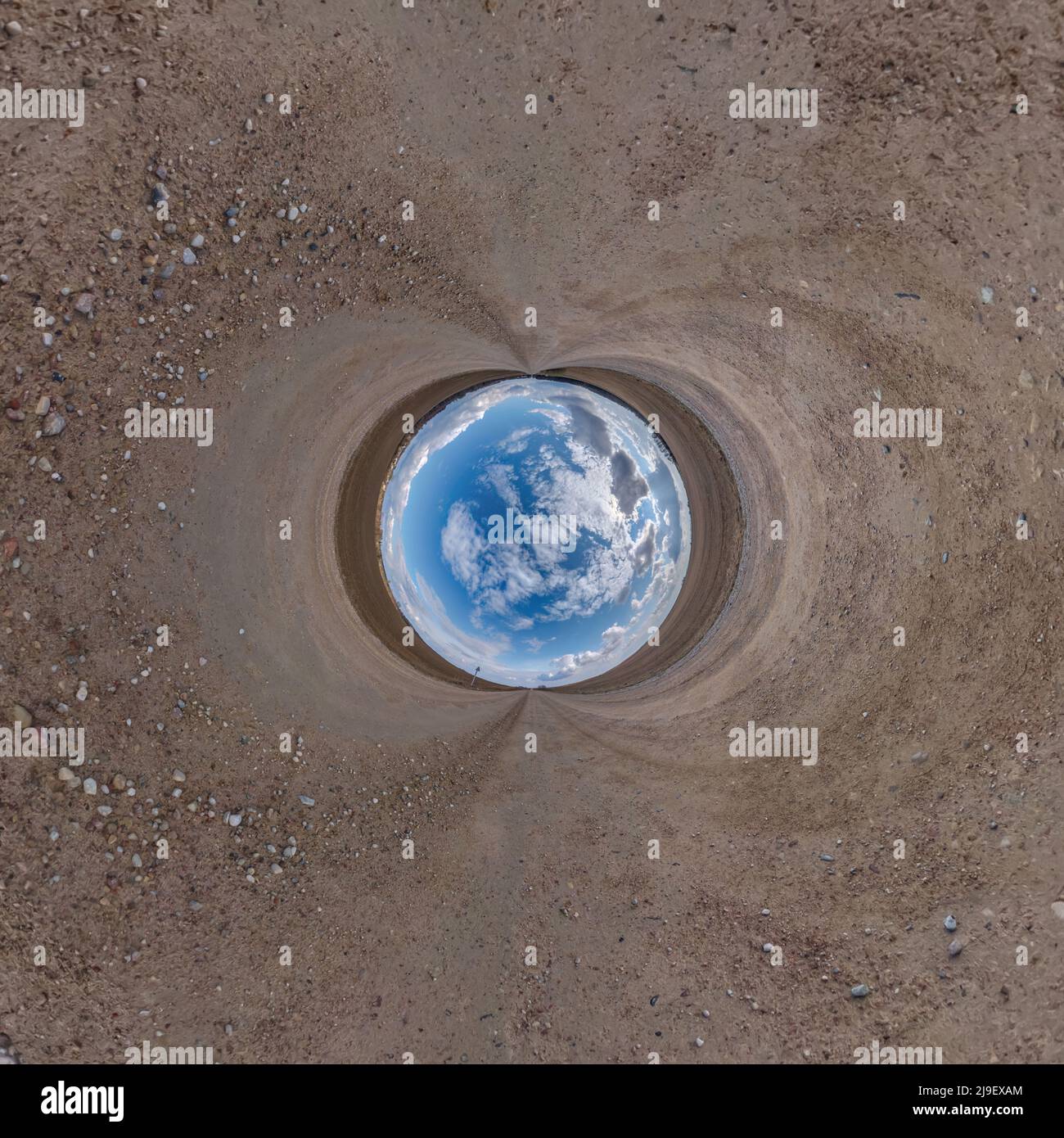 blue sphere little planet inside gravel road or field background ...