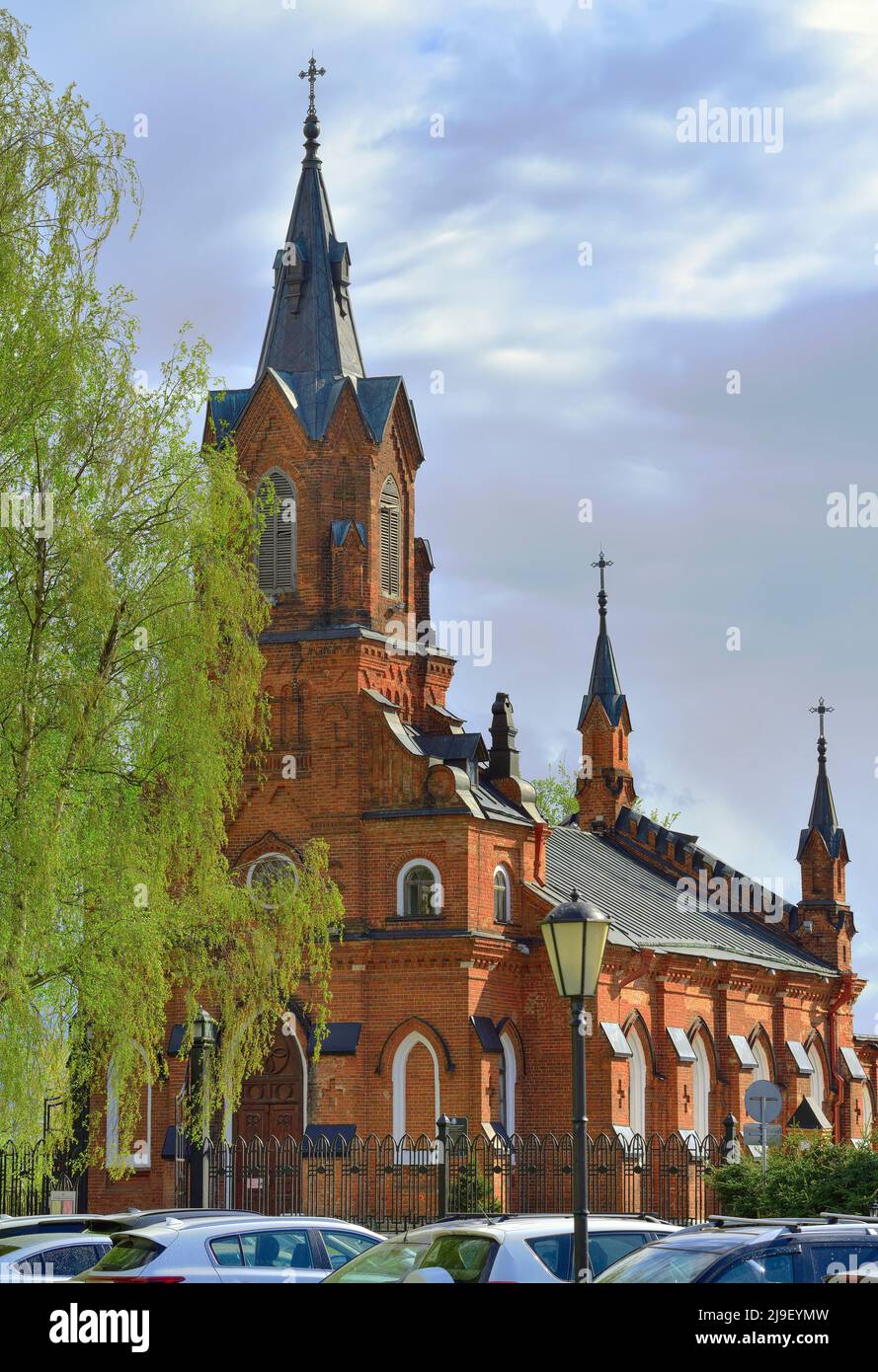 The Church of the Holy Rosary. The Catholic church is made of red brick ...